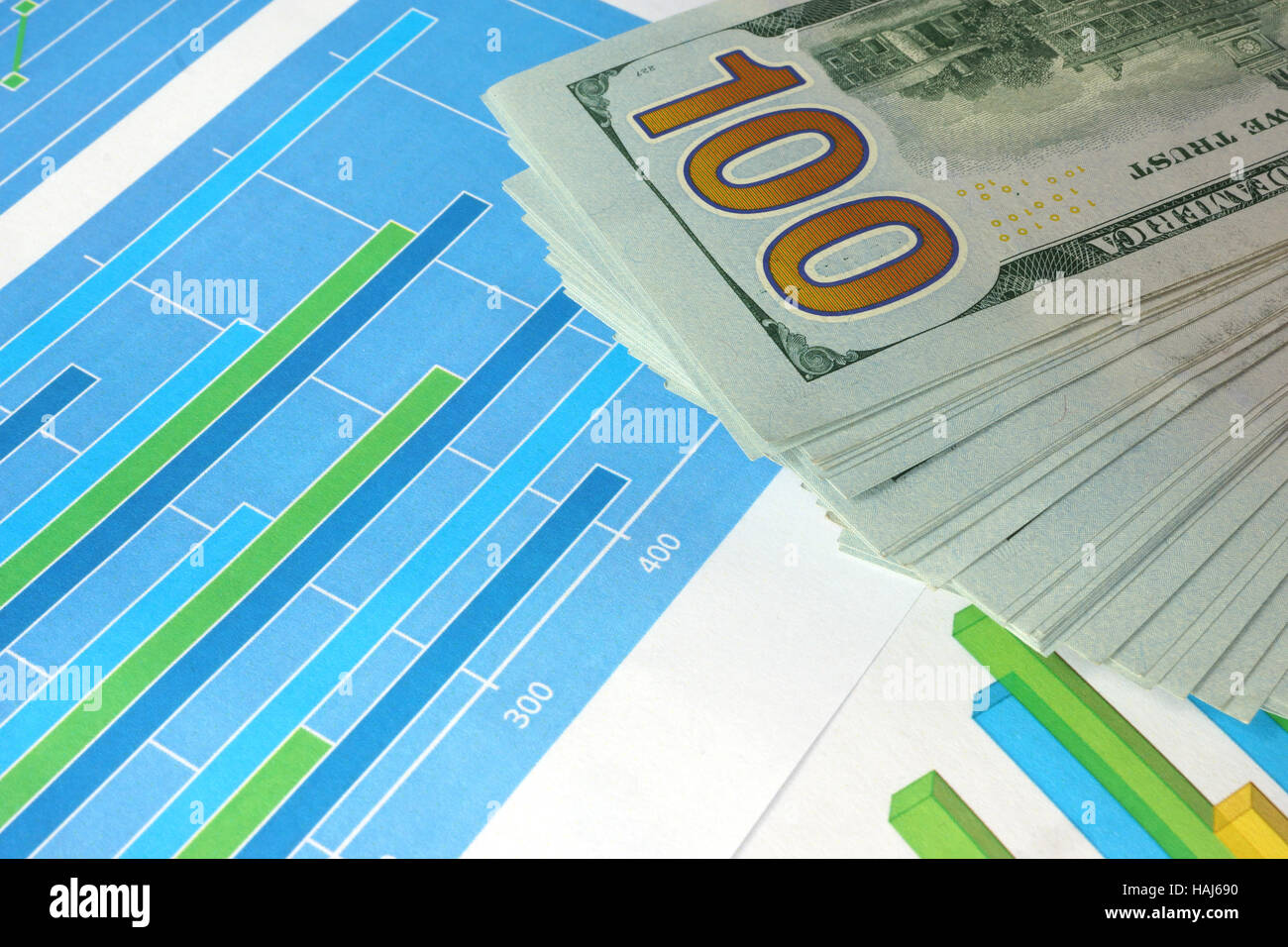 Charts and currency on a table. Business concept Stock Photo - Alamy
