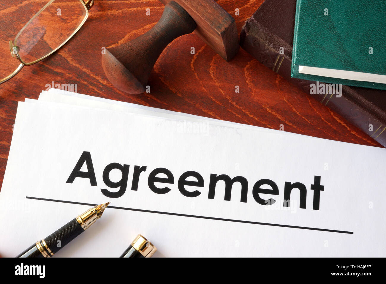 Agreement form on an office table Stock Photo - Alamy