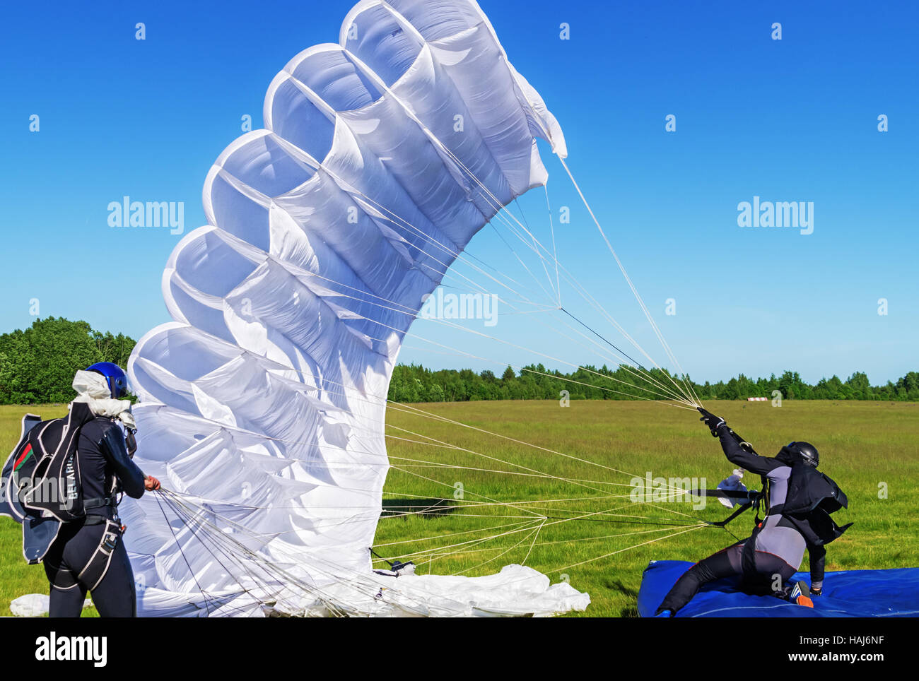 Parachutists - 2015.Landing on airfield Stock Photo - Alamy