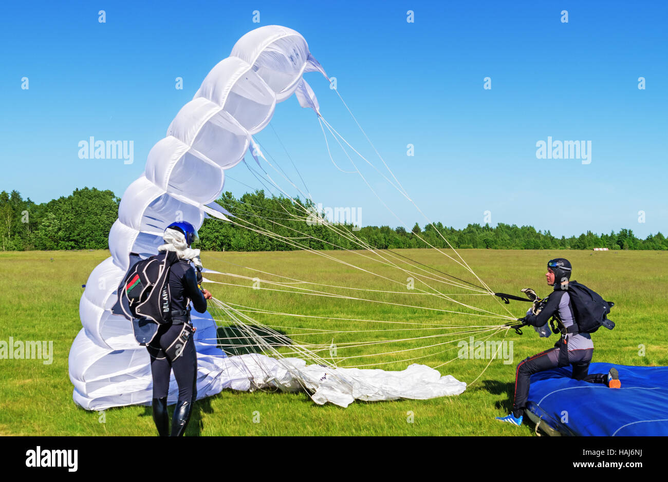 Parachutists - 2015.Landing on airfield Stock Photo - Alamy