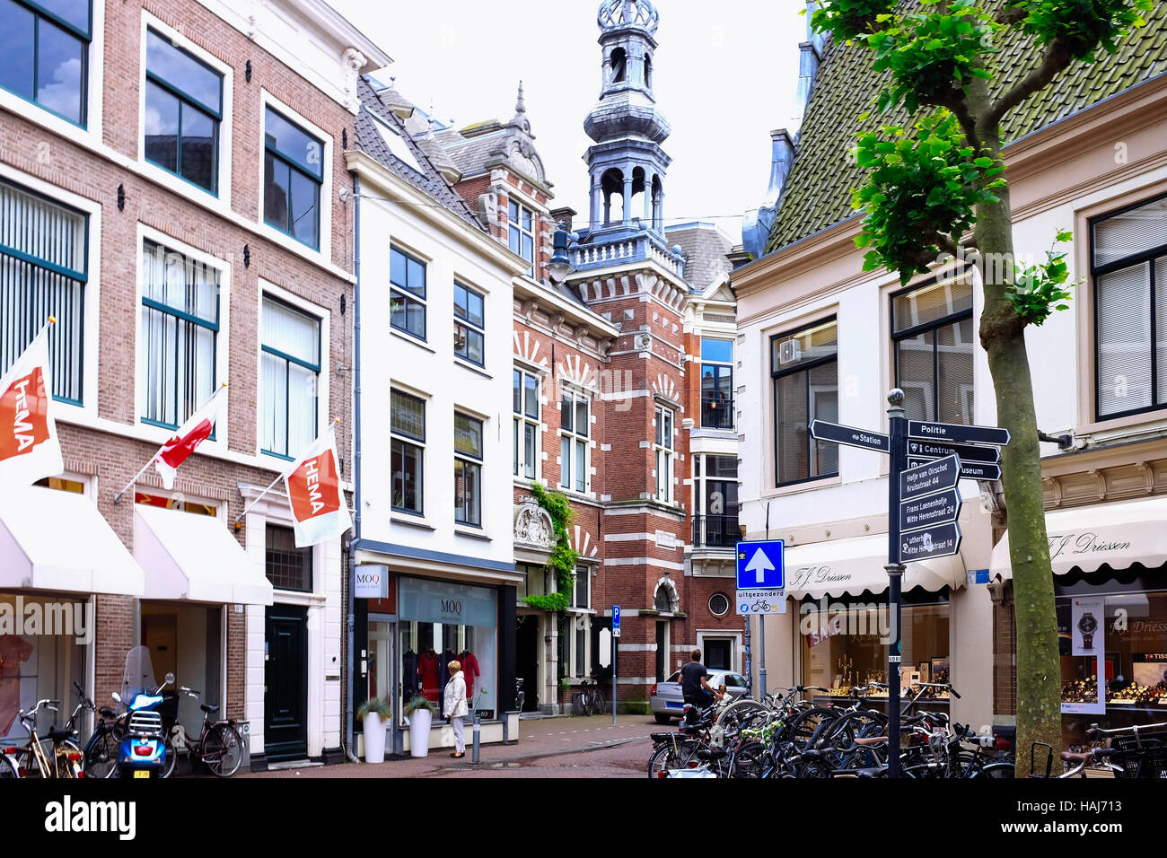 Haarlem, Netherlands 06-16-2016: may parked bicycles and people walking ...