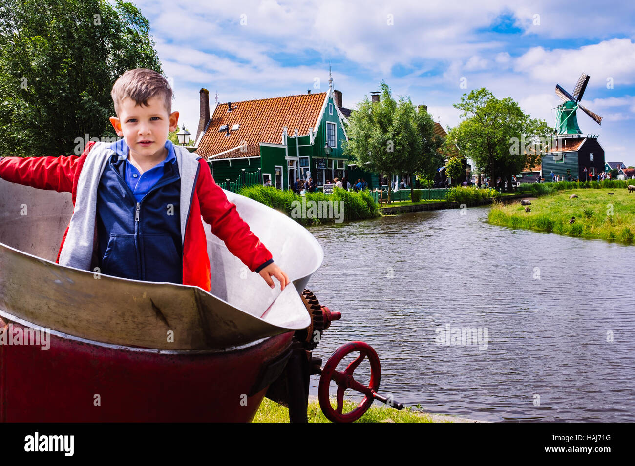 Child Playing In traditional Dutch Equipment old wooden windmill in ...