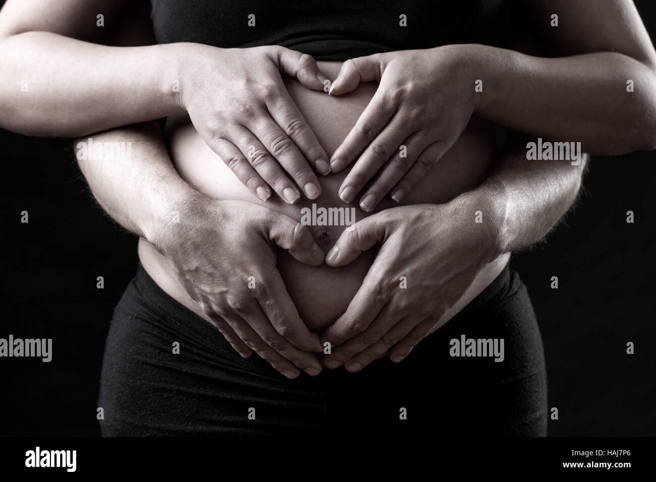 Portrait of young and delighted parents expecting a baby Stock Photo ...