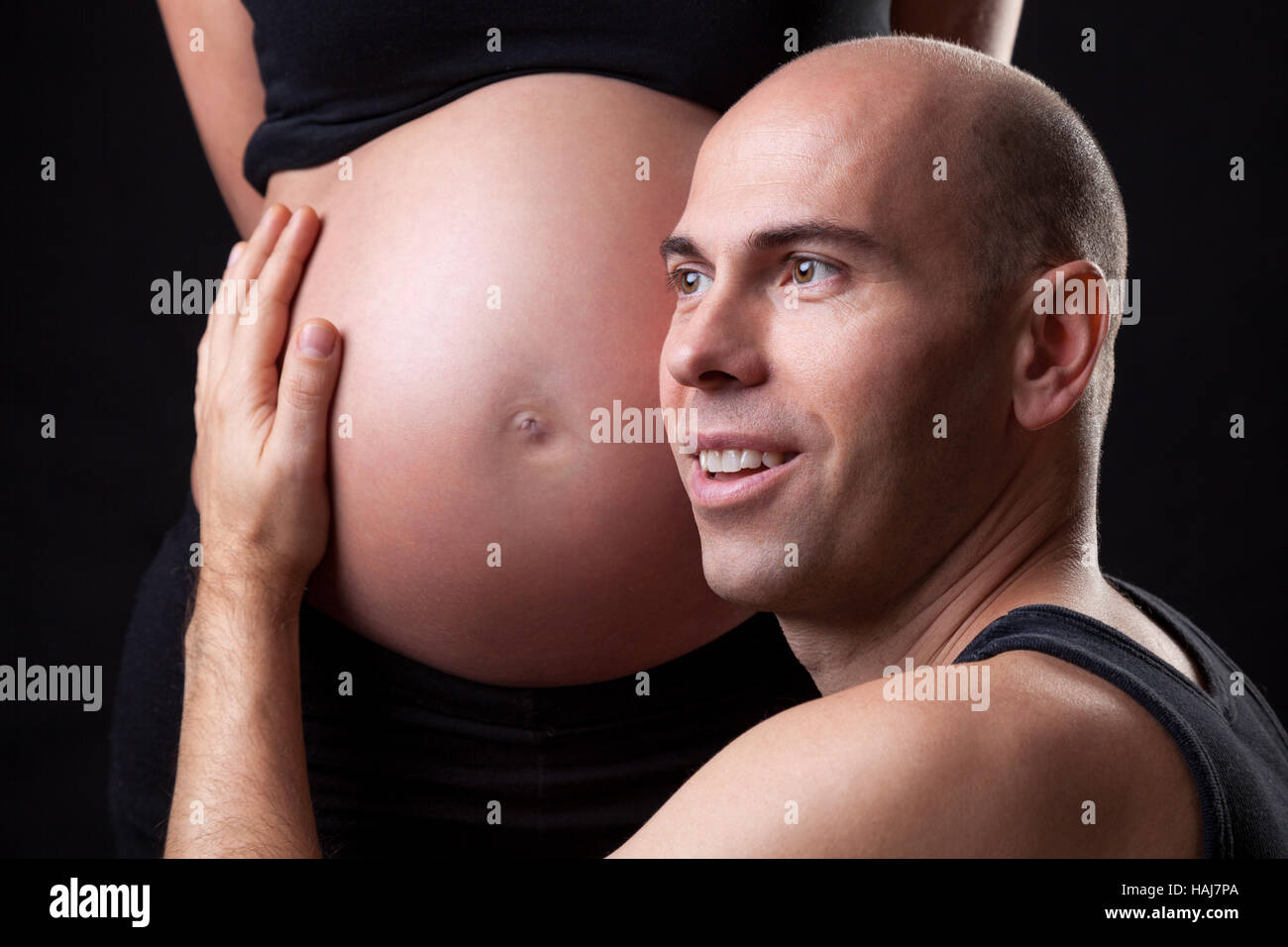 Portrait of young and delighted father expecting a baby Stock Photo - Alamy