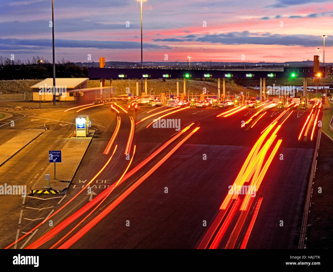 Tyne tunnel automatic non operator toll booths traffic at sunset Stock ...