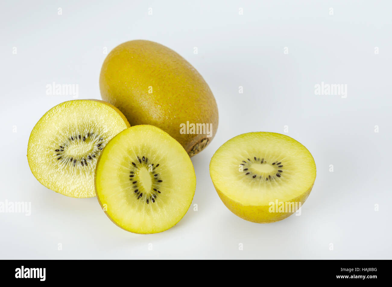 delicious whole kiwi fruit and half on white background Stock Photo - Alamy