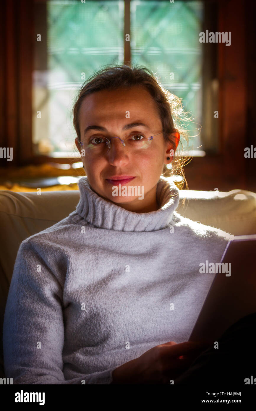 Pretty girl portrait with sunlight in a room Stock Photo - Alamy