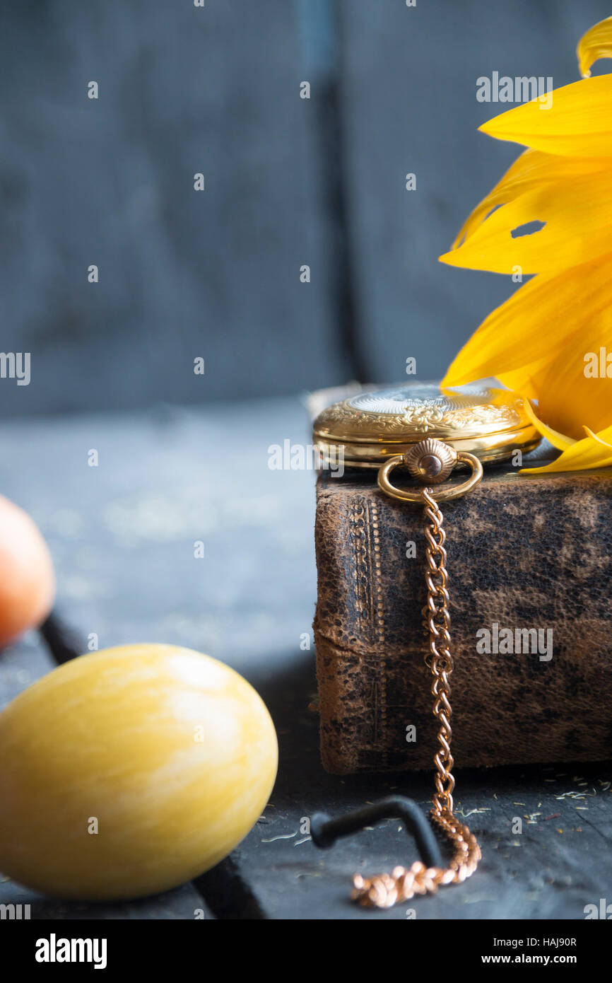 egg and a gold pocket watch, easter background Stock Photo - Alamy