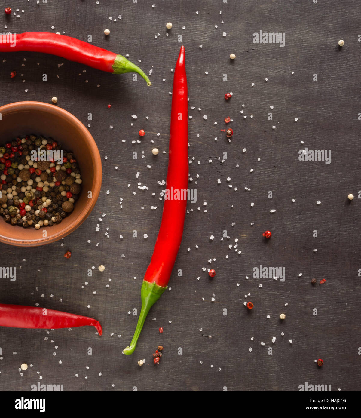 Parsley dill pepper and garlic in a dark wooden table. View from above ...