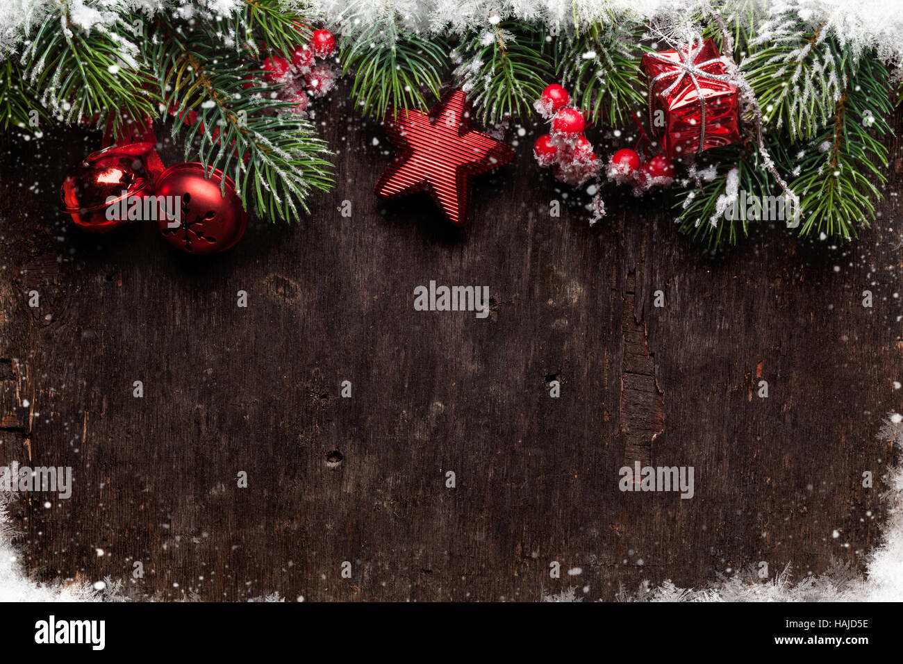 Christmas fir tree and decor over old wooden texture background. Top ...