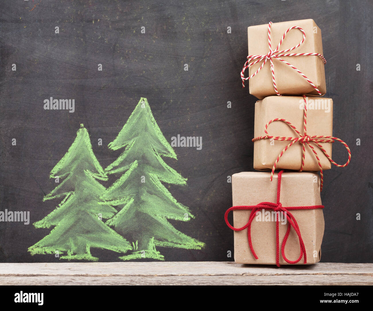 Christmas gift boxes and hand drawn xmas fir tree Stock Photo - Alamy