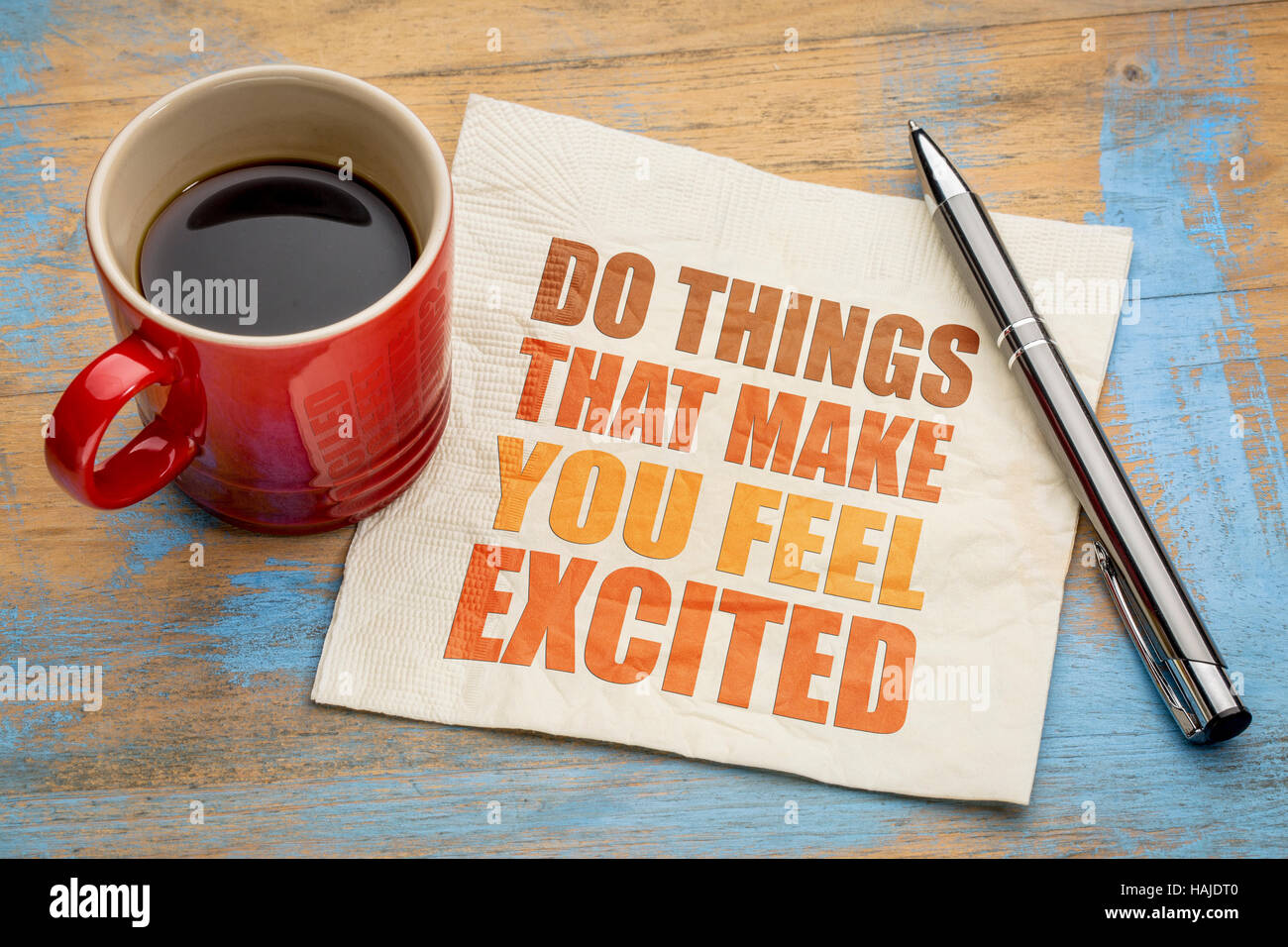 Do things that make you feel excited - word abstract on a napkin with a ...