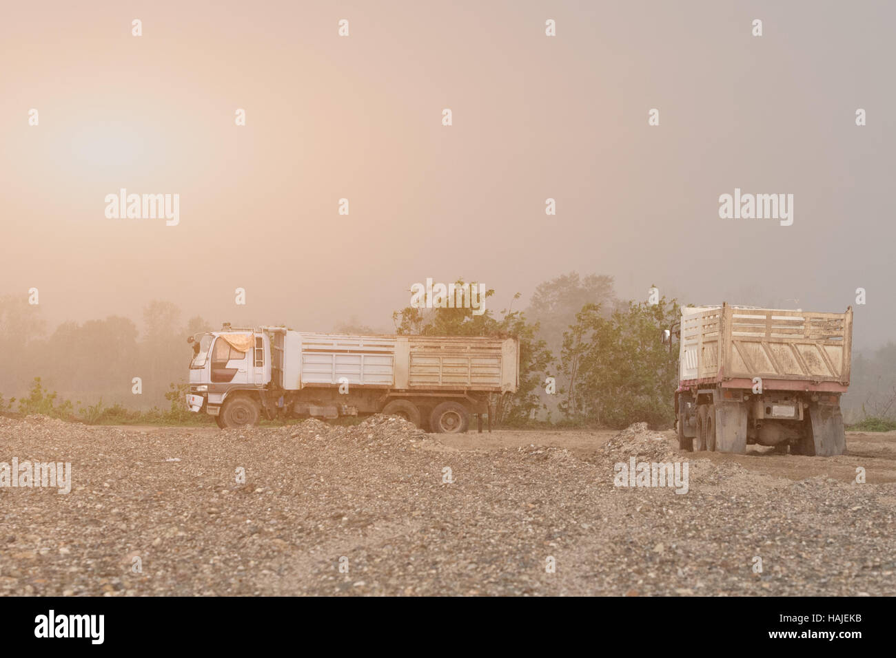 Two Dump trucks on an excavation site Stock Photo - Alamy