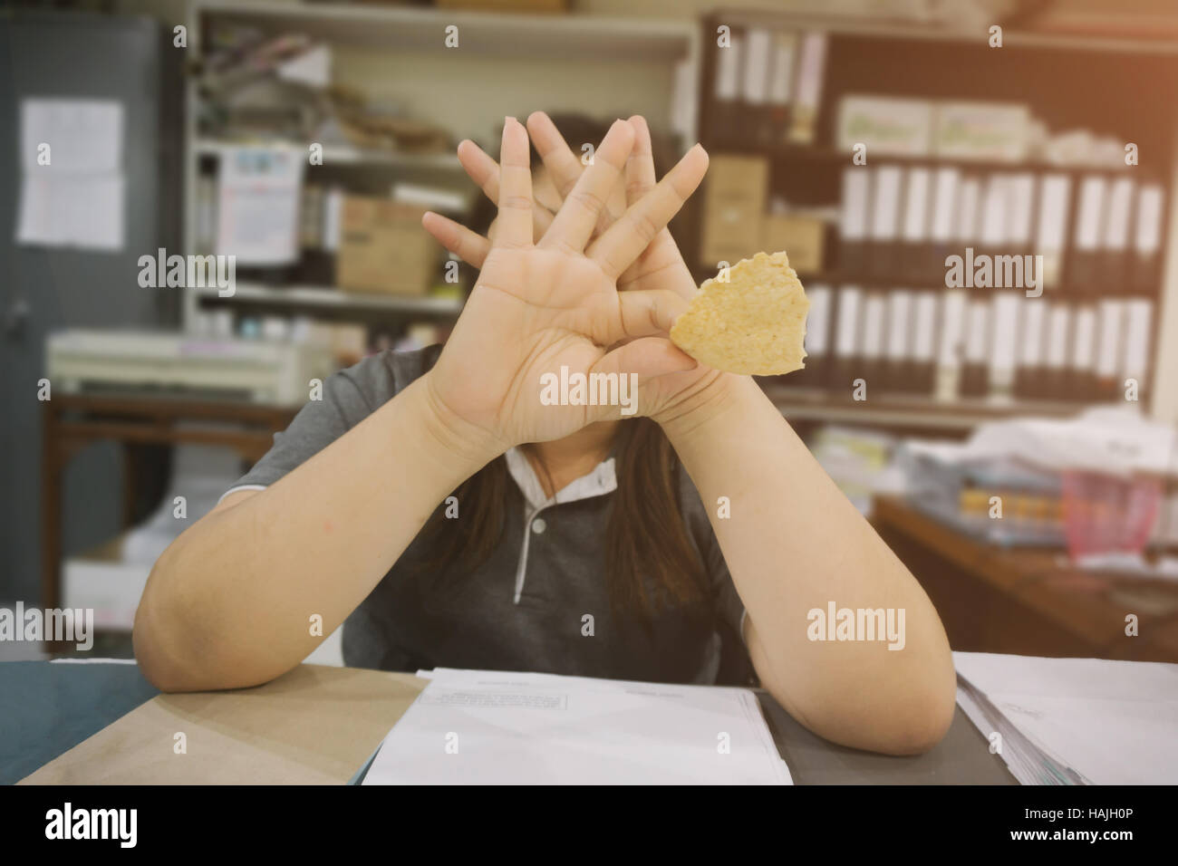 woman eating fried potato chip Stock Photo - Alamy