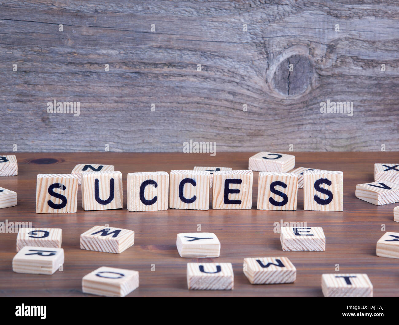 Success from wooden letters on wooden background Stock Photo - Alamy