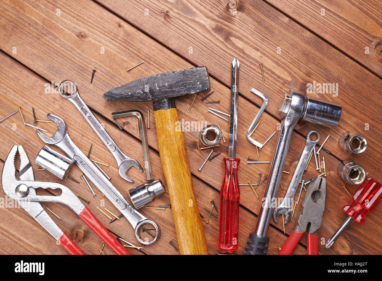 Set of different work tools on wooden surface Stock Photo - Alamy