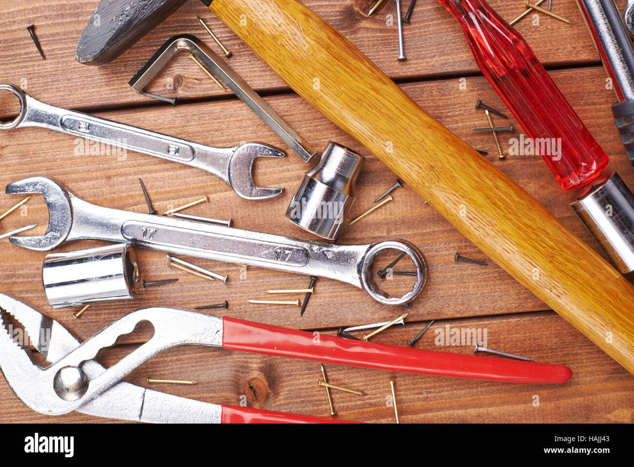 Set of different work tools on wooden surface Stock Photo - Alamy