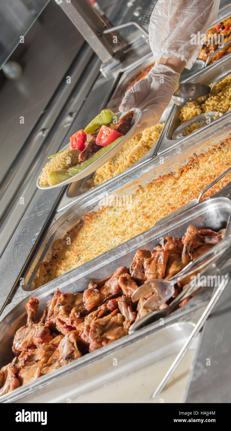 chef standing behind full lunch service station Stock Photo - Alamy
