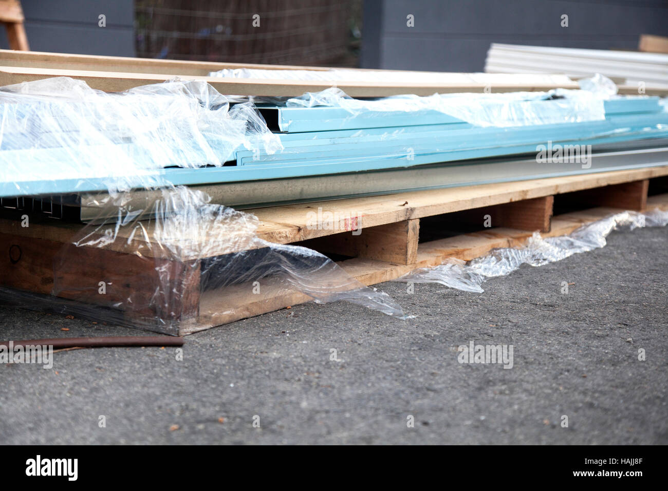 Construction materials on wood pallet Stock Photo - Alamy