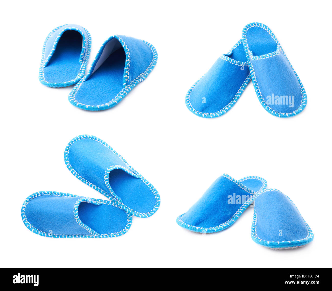 Pair of house slippers isolated over white background Stock Photo - Alamy
