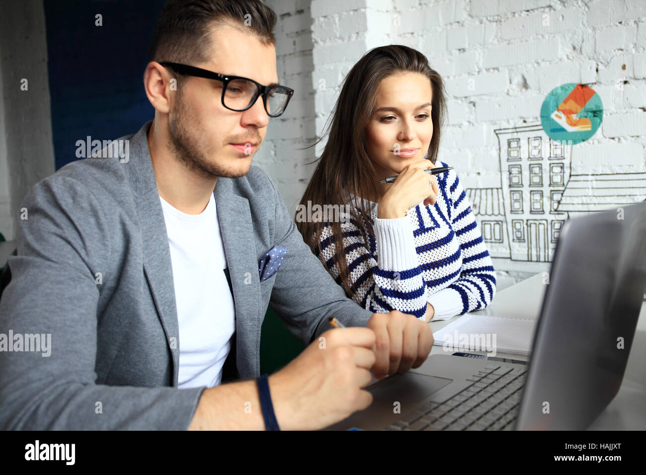 Young professionals work in modern office.Business crew working with startup Stock Photo - Alamy