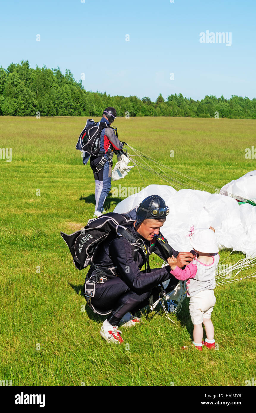 Parachutists - 2015.After landing.Skydiver and their child Stock Photo ...