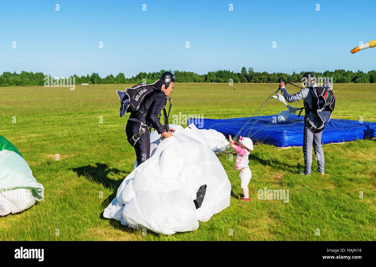 Parachutists - 2015.After landing.Skydiver and their child Stock Photo ...