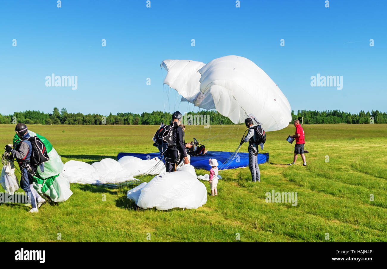 Parachutists - 2015.After landing.Skydivers and their child Stock Photo ...