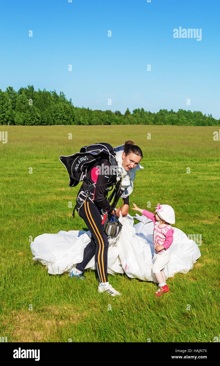 Parachutists - 2015.After landing.Skydivers and their child Stock Photo ...