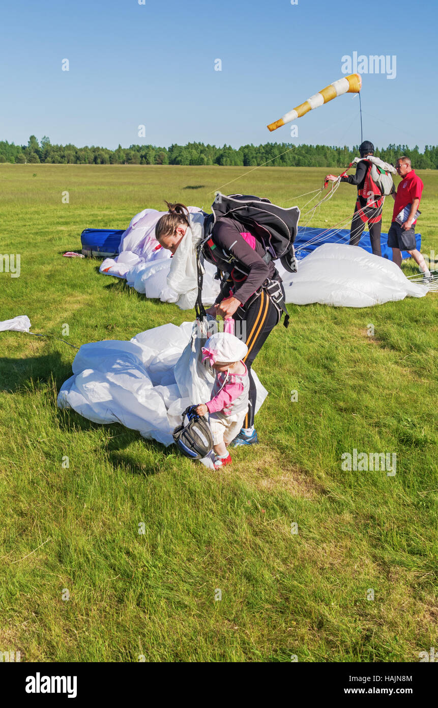 Parachutists - 2015.After landing.Skydivers and their child Stock Photo ...