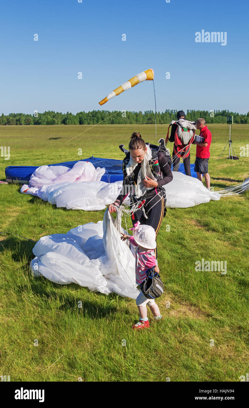 Parachutists - 2015.After landing.Skydivers and their child Stock Photo ...