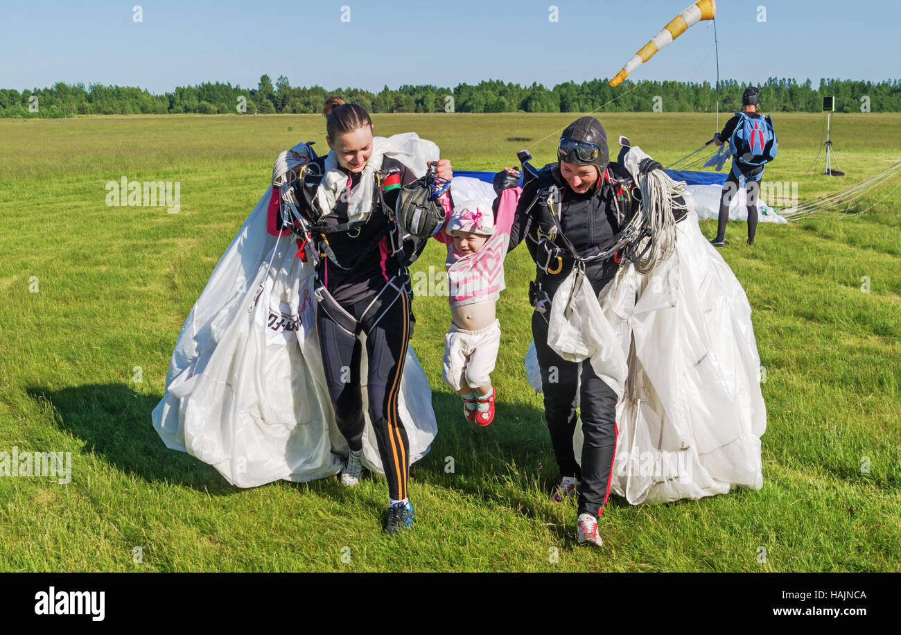 Parachutists - 2015.After landing.Skydivers and their child Stock Photo ...
