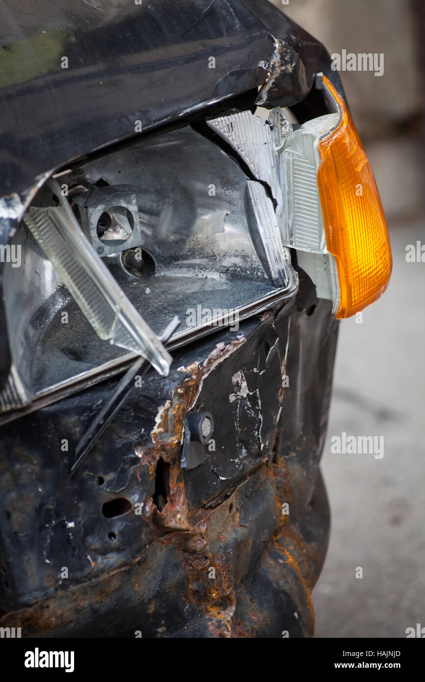 Color image of a crashed car with broken headlight Stock Photo - Alamy