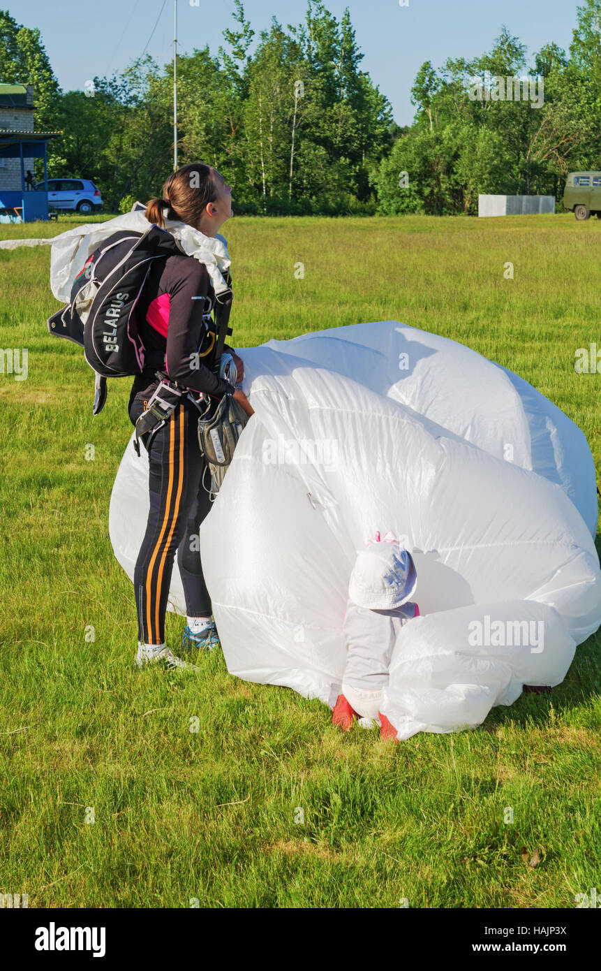 Parachutists - 2015.After landing.Skydivers and their child Stock Photo ...