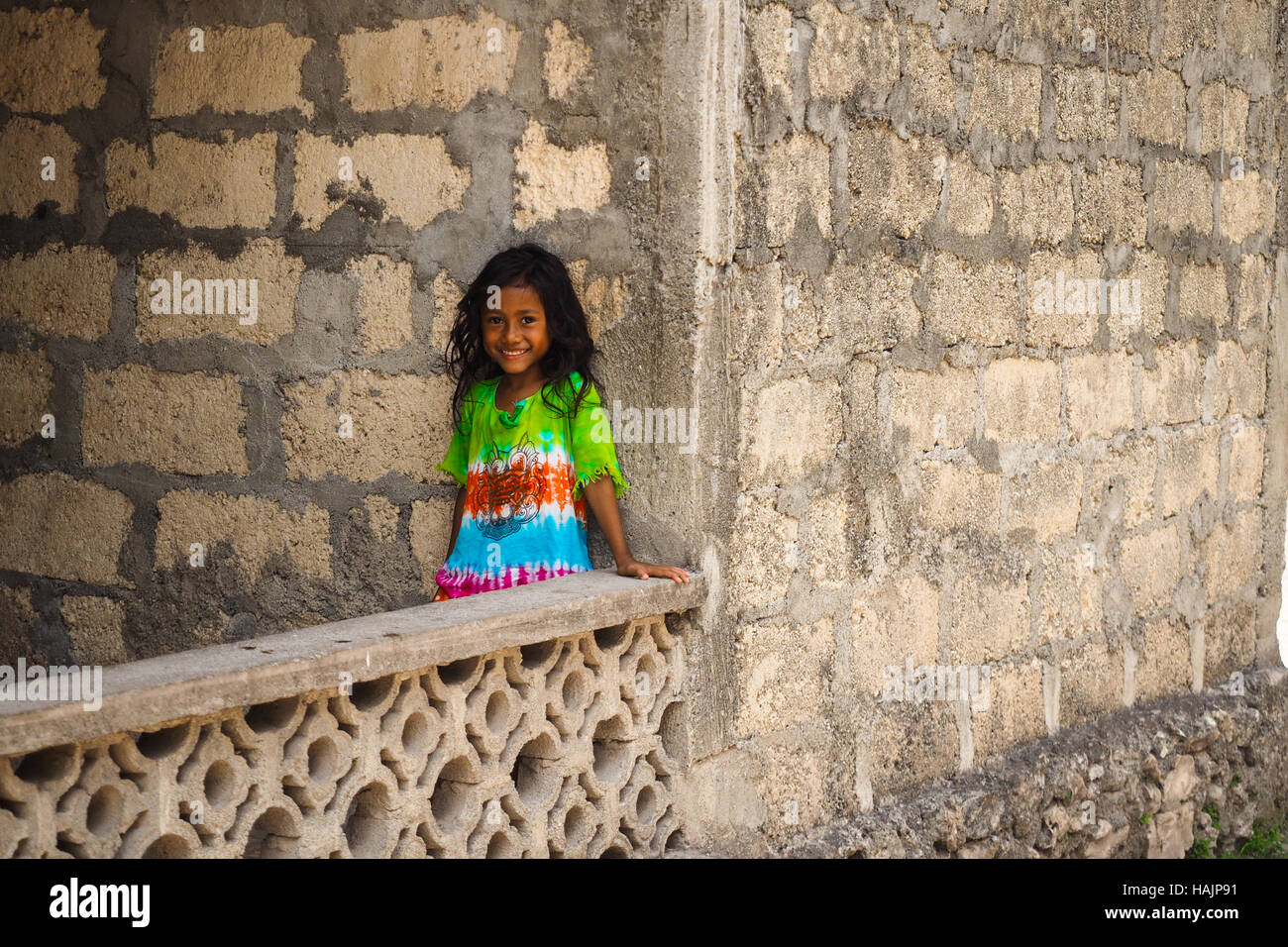 'Happy Girl' at House in Gari-Uai, Timor Leste Stock Photo - Alamy