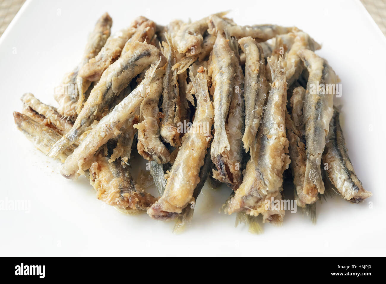 Dish cooked and ready breaded anchovies and fried in oil. Italian ...