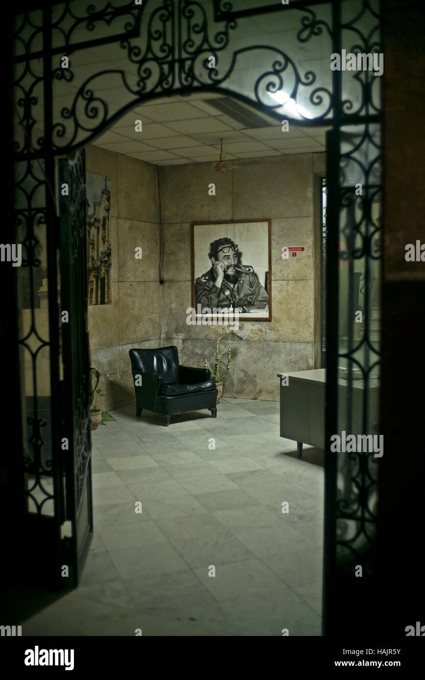 A photograph of Fidel Castro hangs in the entrance of municipal ...