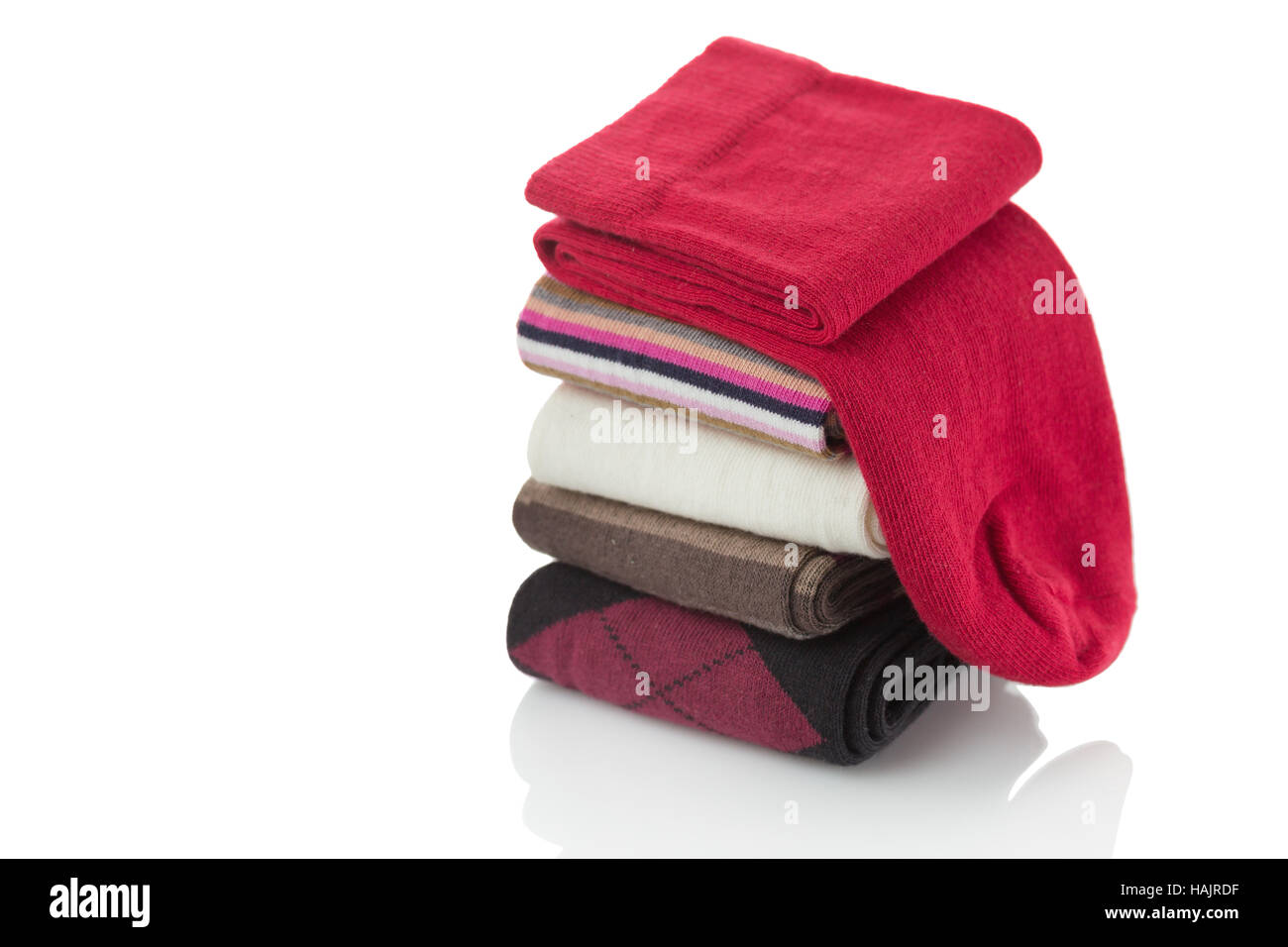 Pile of folded socks over white background Stock Photo - Alamy