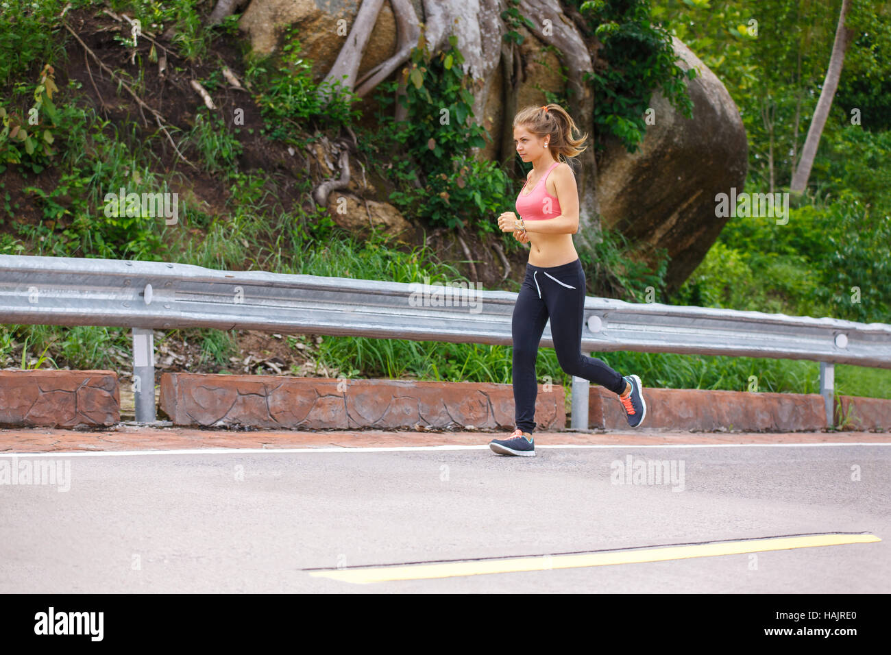 Fitness woman running forest trail hi-res stock photography and images ...