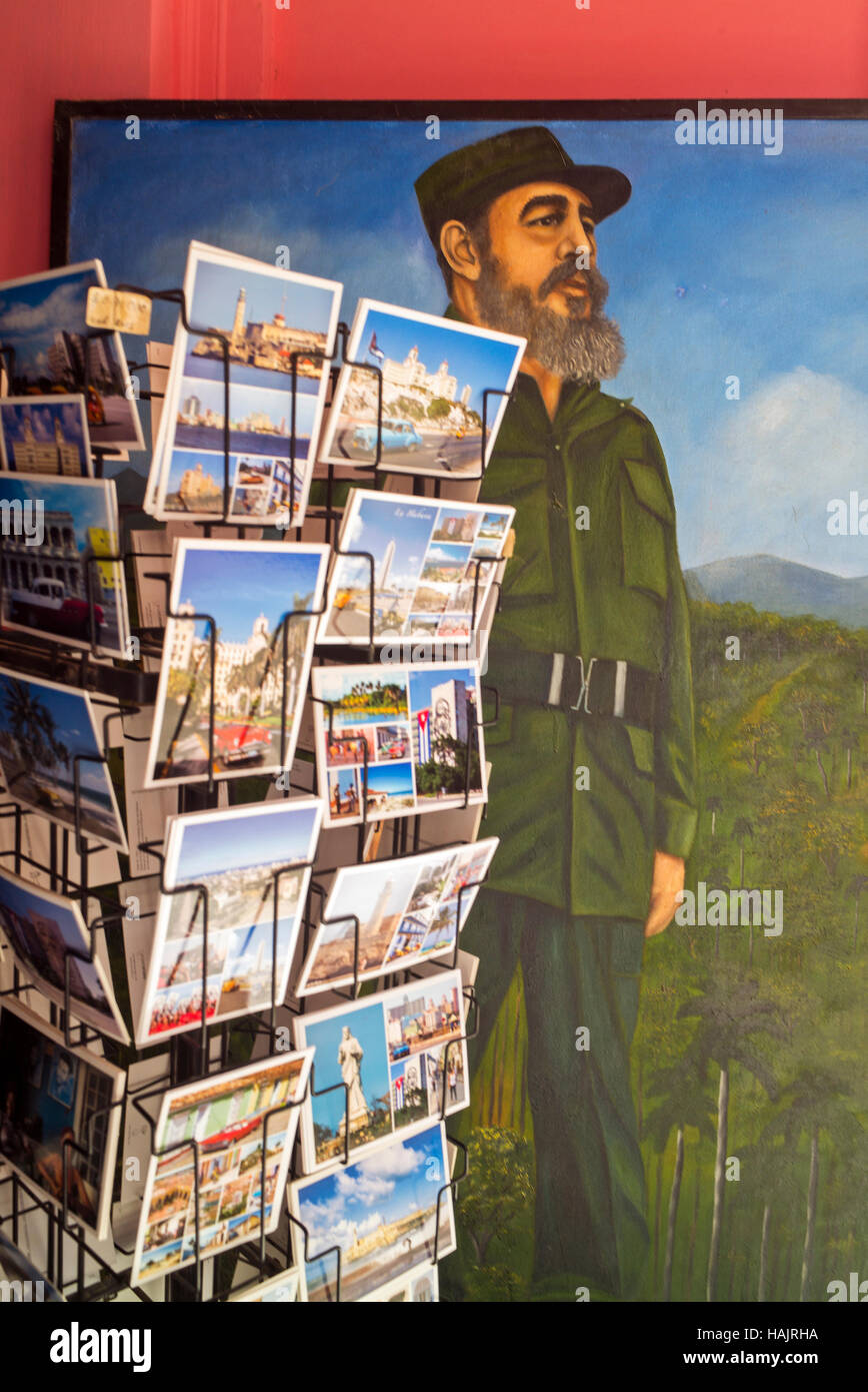 Fidel Castro painting behind tourist post card rack in Havana Cuba ...