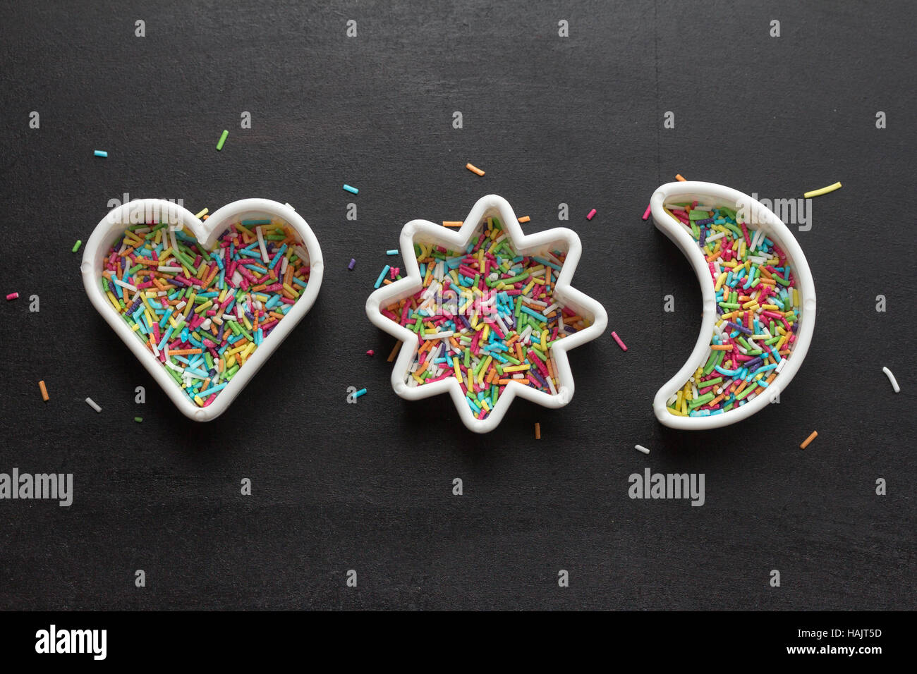 Cookie cutters with candy sprinkles Stock Photo - Alamy