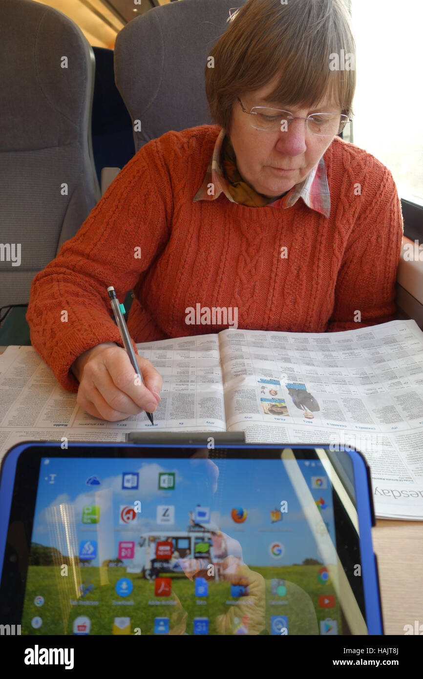 Tablet newspaper train hi-res stock photography and images - Alamy