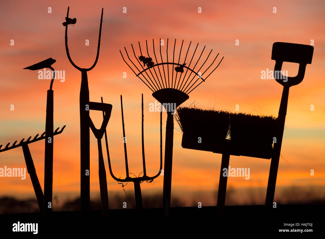 Garden tools at sunset in winter Stock Photo - Alamy