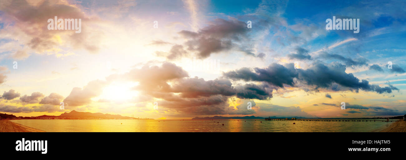 Panorama of beautiful sunset on the ocean Stock Photo - Alamy