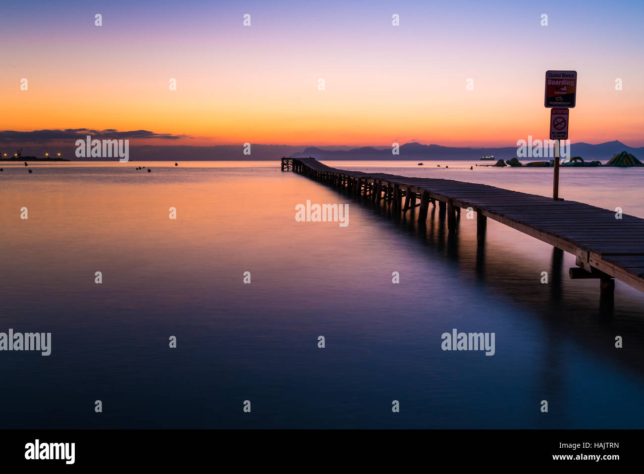 wooden jetty in sea bay at night Stock Photo - Alamy