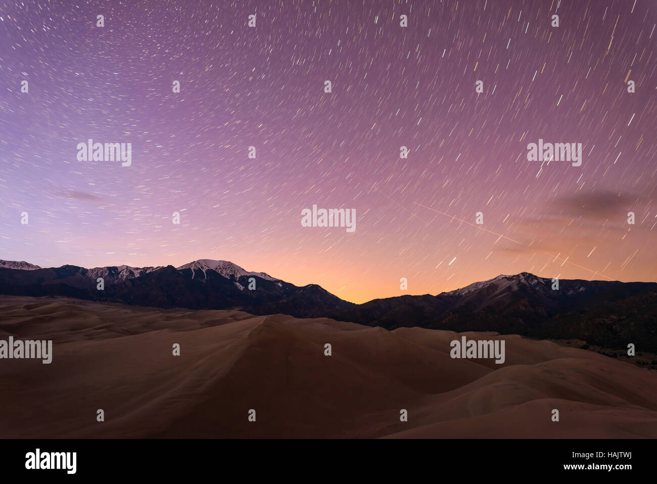 Starry Night at Great Sand Dunes - Star trails of spring night sky over ...