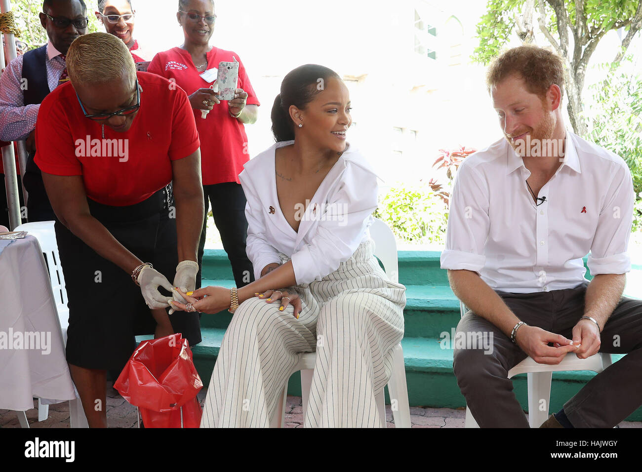 Rihanna (centre) and Prince Harry take part in a live HIV test, at the ...