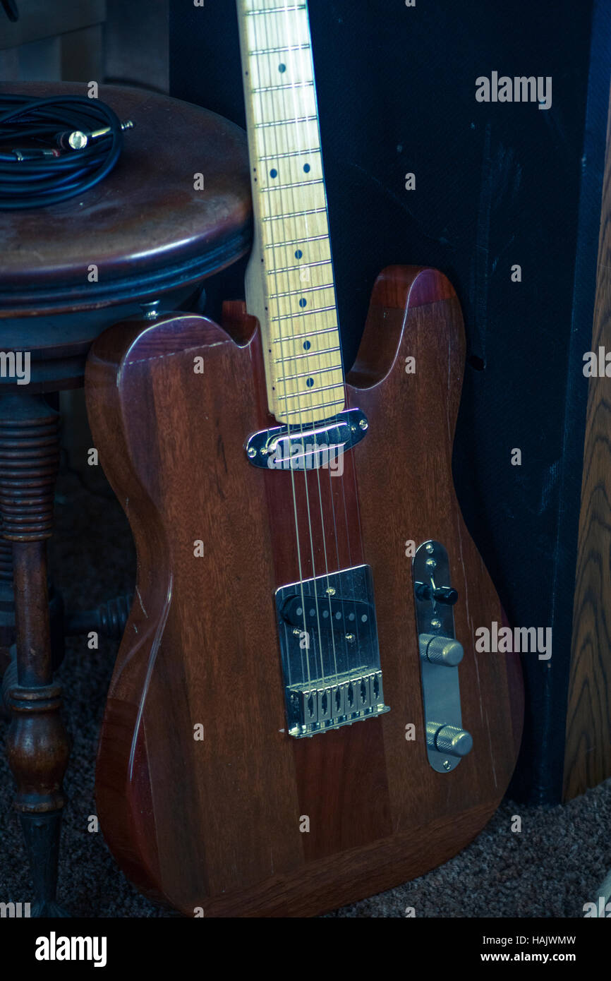 A funky Telecaster style guitar made of different species of wood glued ...