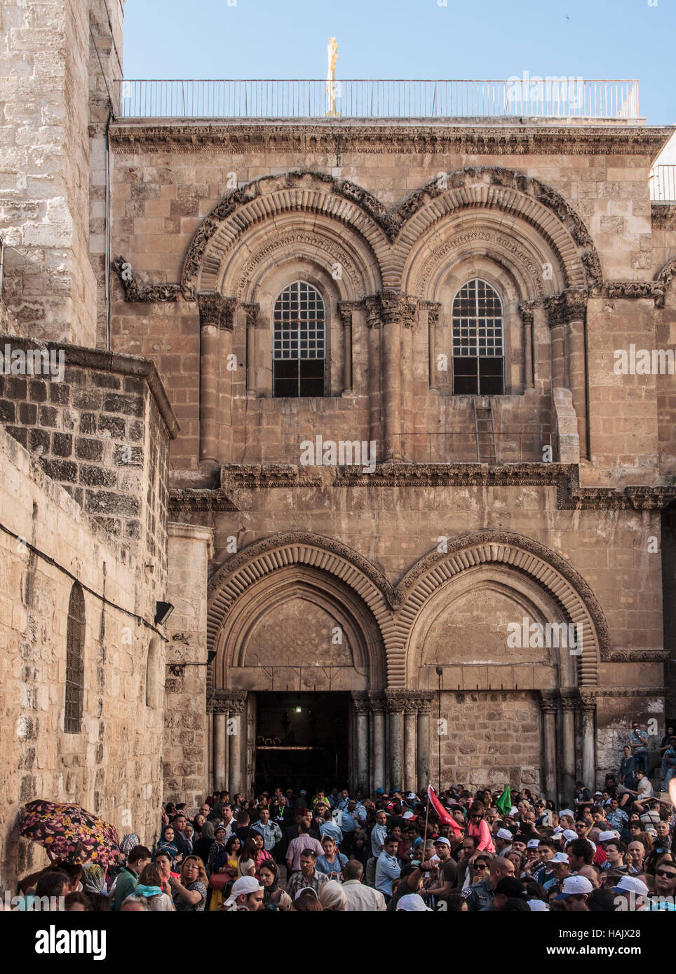 JERUSALEM - APRIL 18, 2014: A crowd of pilgrims fills the front yard of ...