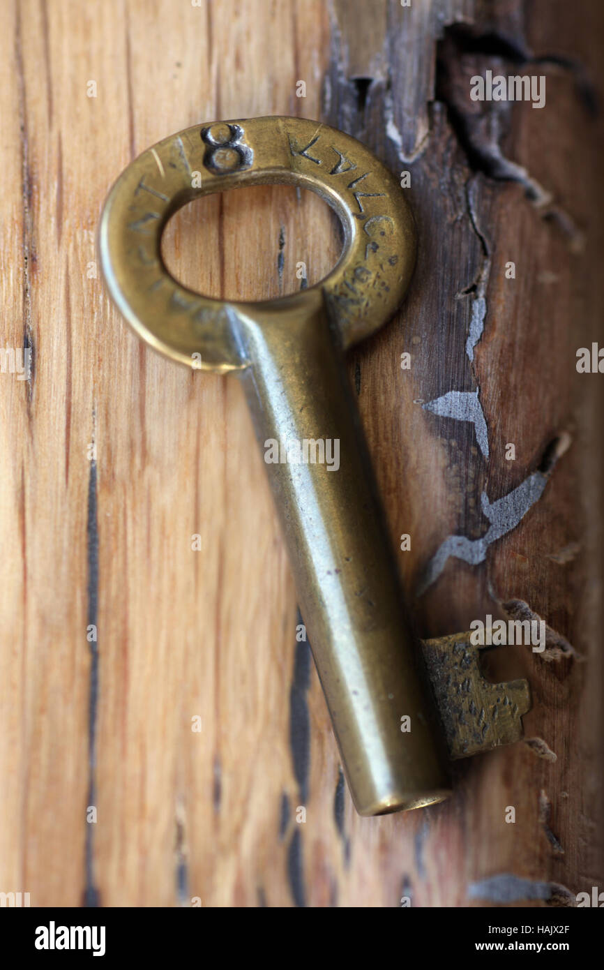 old brass key on rustic gnarled oak sill Stock Photo - Alamy